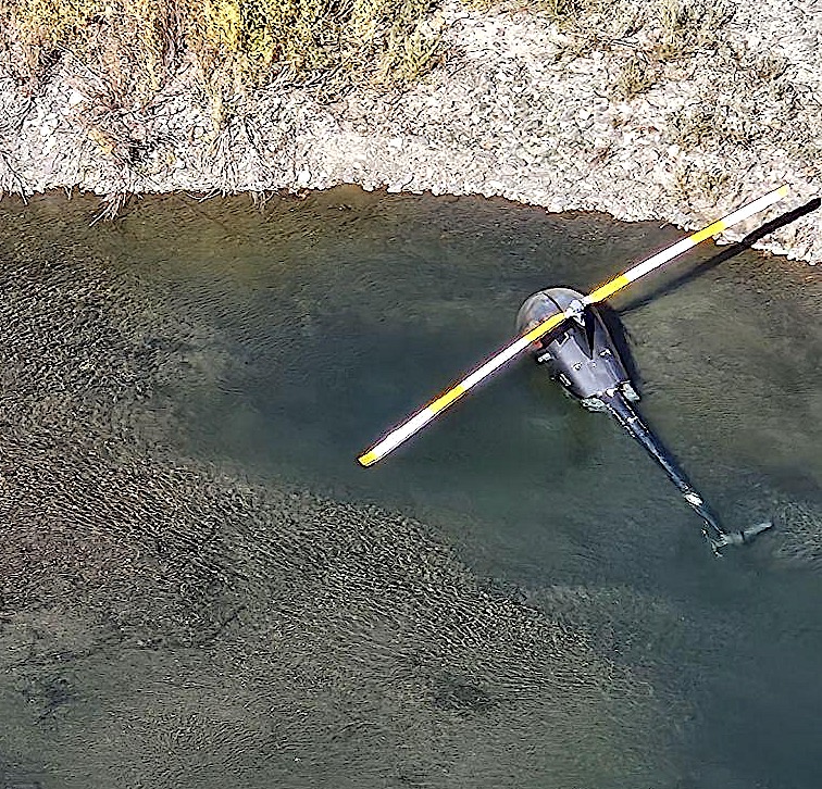 Pilot rescued after helicopter ends up in river | Serving Minden ...