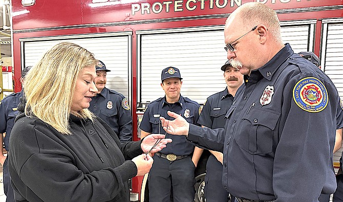 Firefighters rescue heirloom from Ranchos apartment fire rubble ...